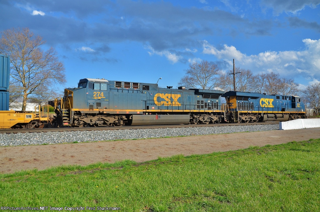 CSX 274 watches the train.